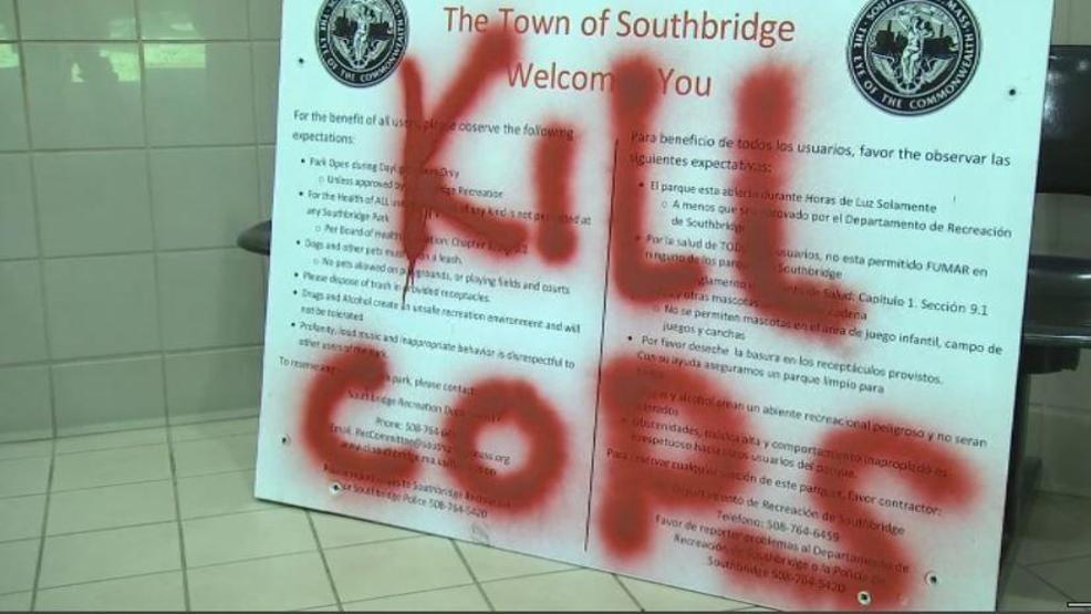 Anti-police graffiti spray painted on town sign | WJAR